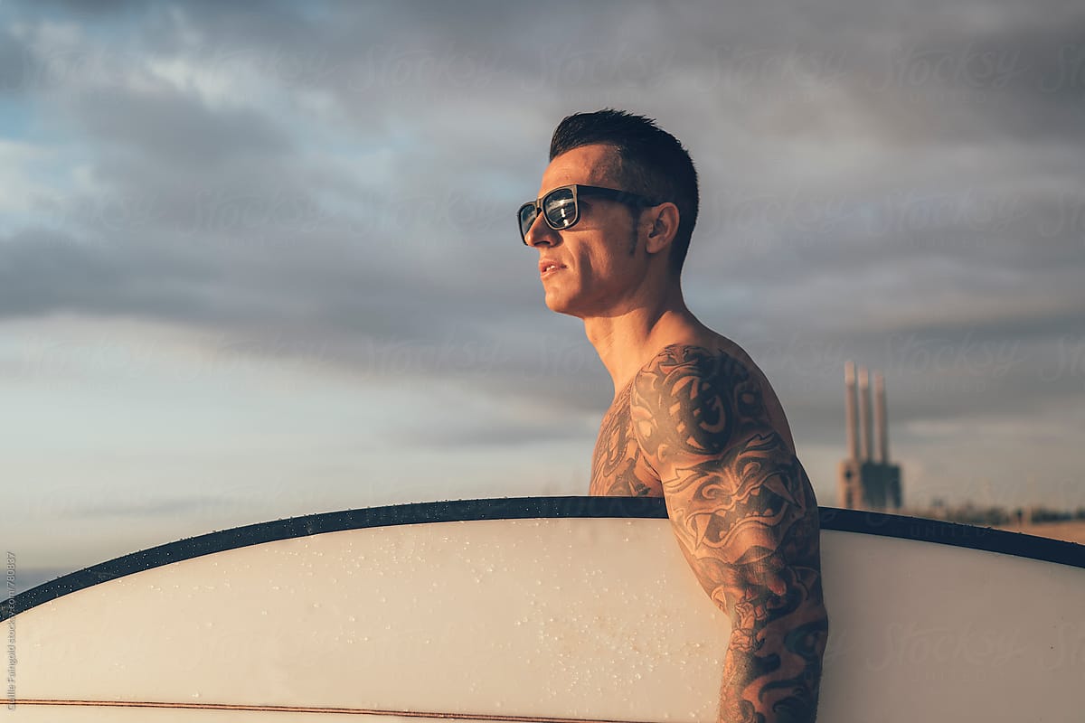 "Surfer In Sunglasses." by Stocksy Contributor "Guille Faingold" - Stocksy
