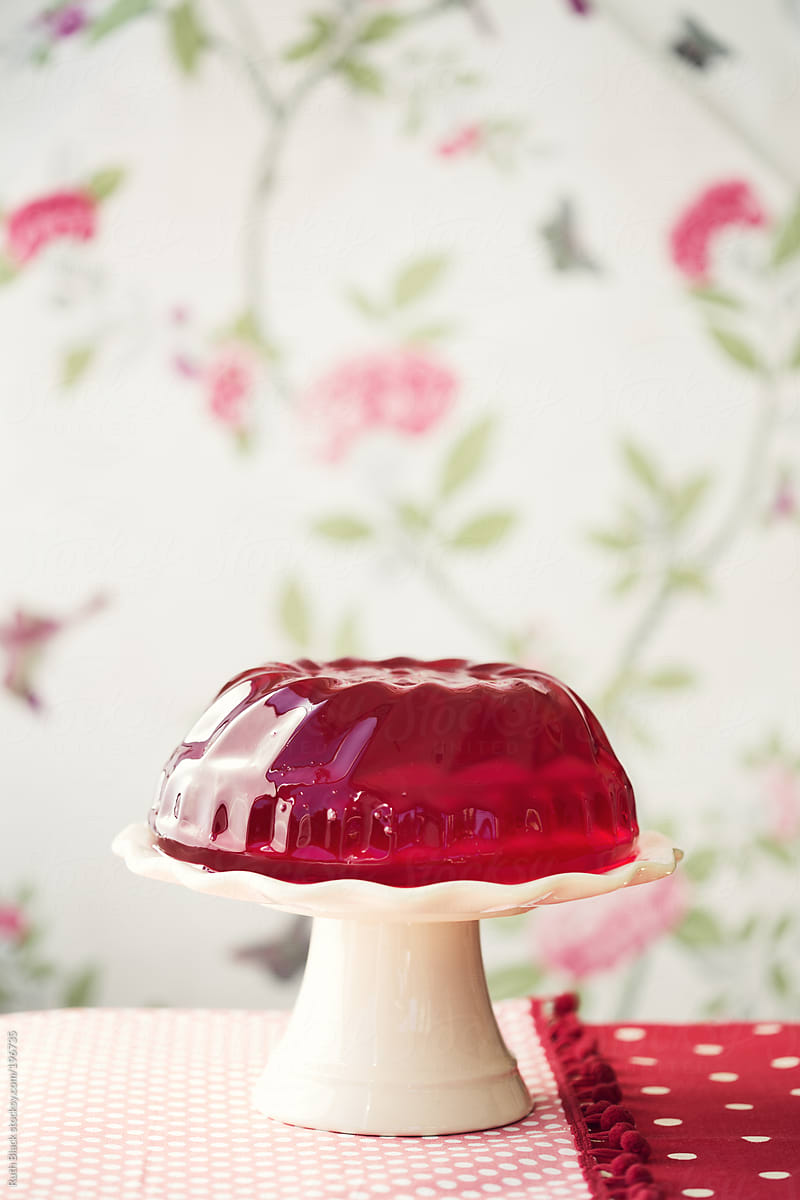 "Red Jello On A Cakestand" by Stocksy Contributor "Ruth Black" - Stocksy