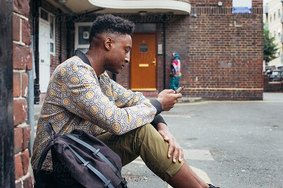 "Profile Of Young Fashionable Black Man Using Smartphone" by Stocksy ...
