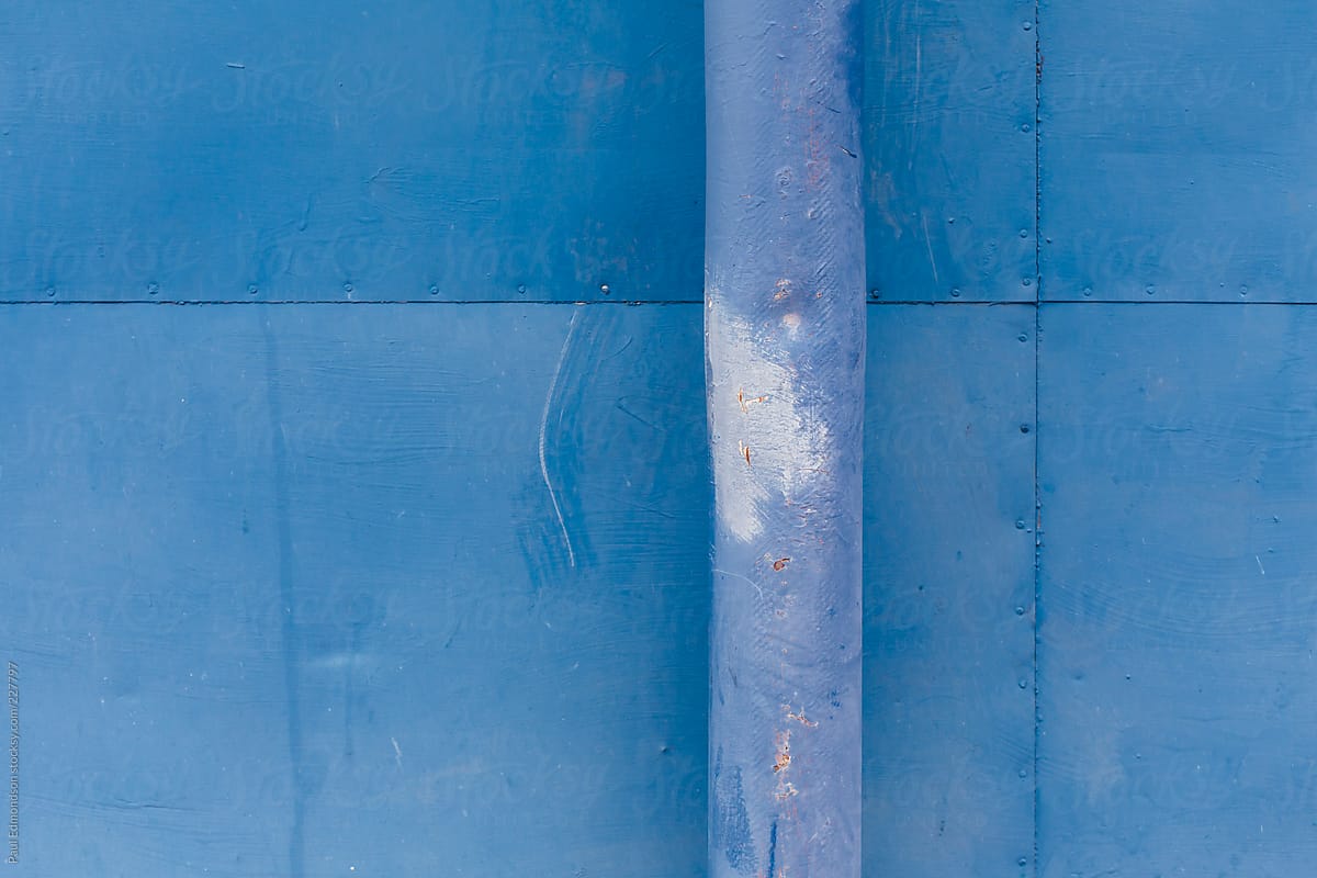 "Blue Drain Pipe And Painted Metal Wall" by Stocksy Contributor "Rialto ...