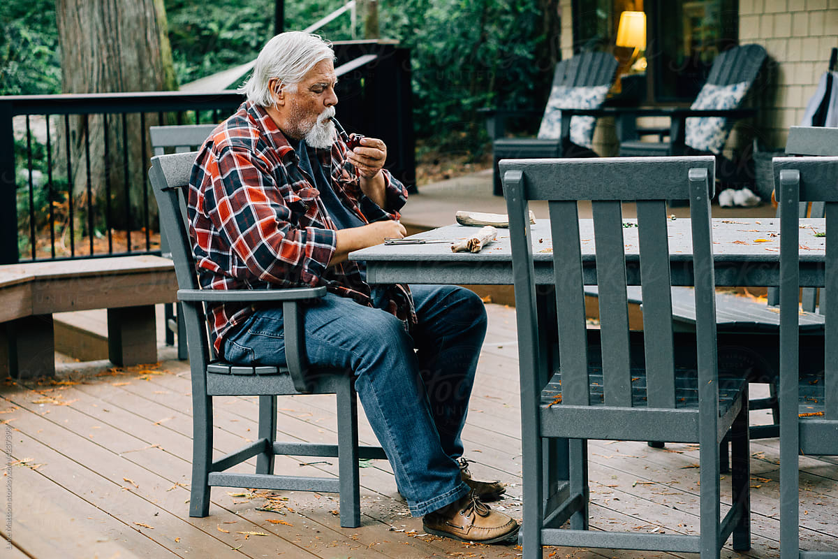 "Grandpa Pipe Smoking" by Stocksy Contributor "Luke Mattson" - Stocksy