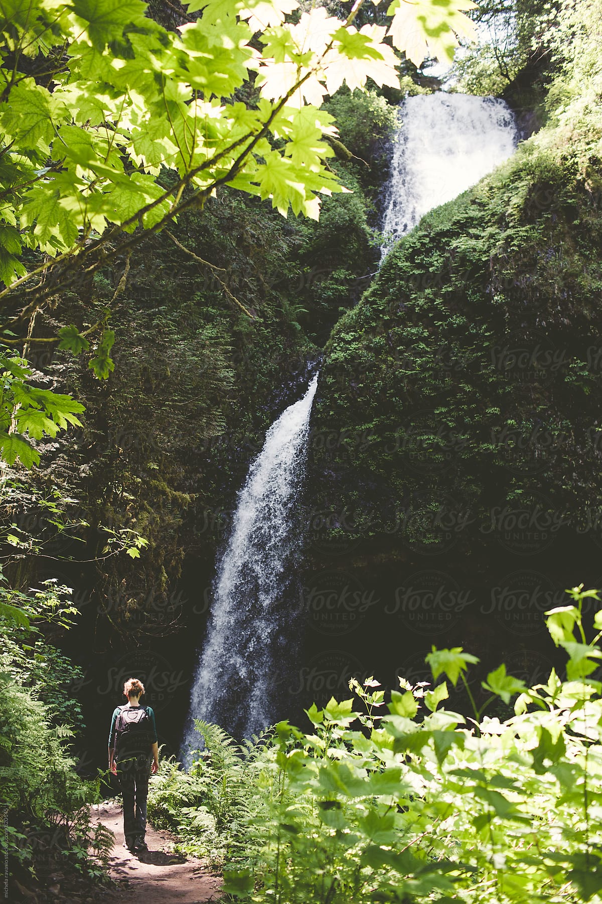 "Woman Walking To Waterfalls" by Stocksy Contributor "Michela Ravasio ...