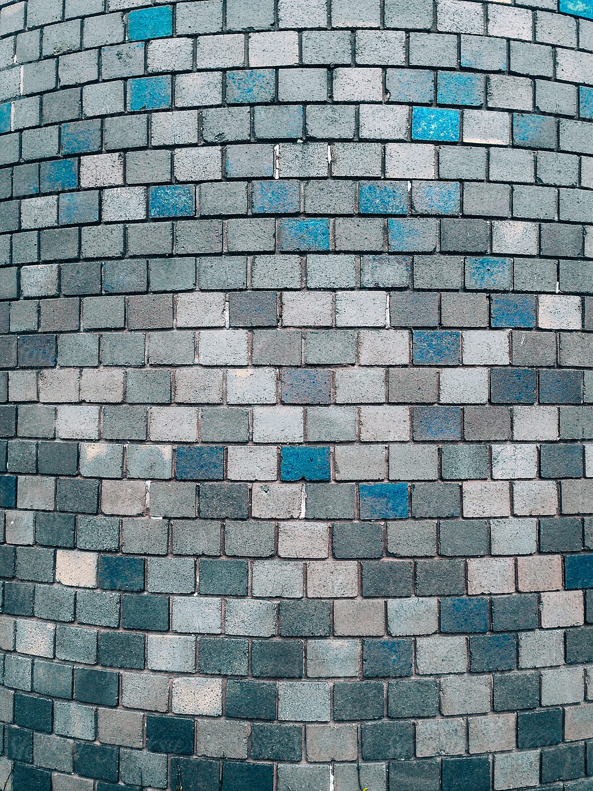 "Blue Brick Round Wall" by Stocksy Contributor "Leandro Crespi" - Stocksy