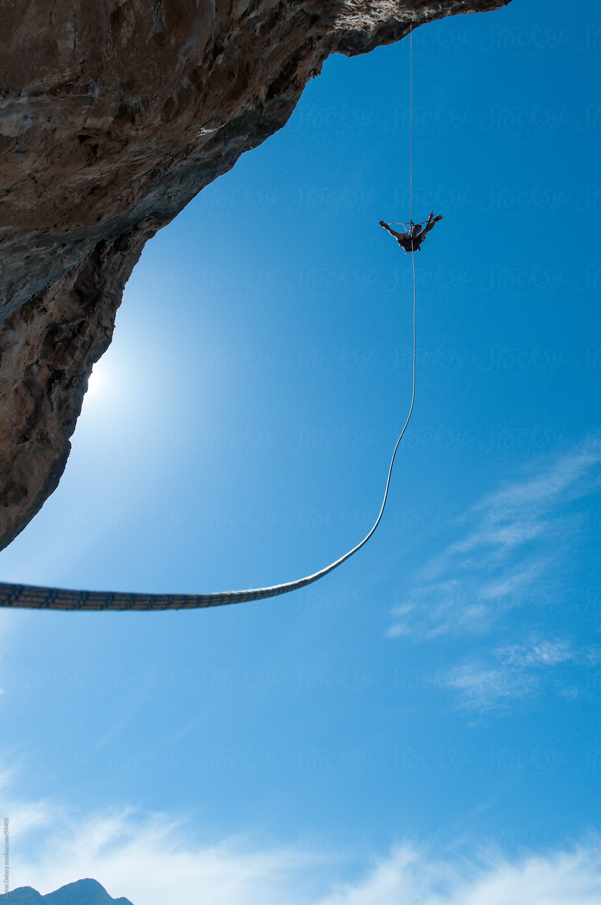 "A Climber Ascends A Rope On A Cliff Face" by Stocksy Contributor ...