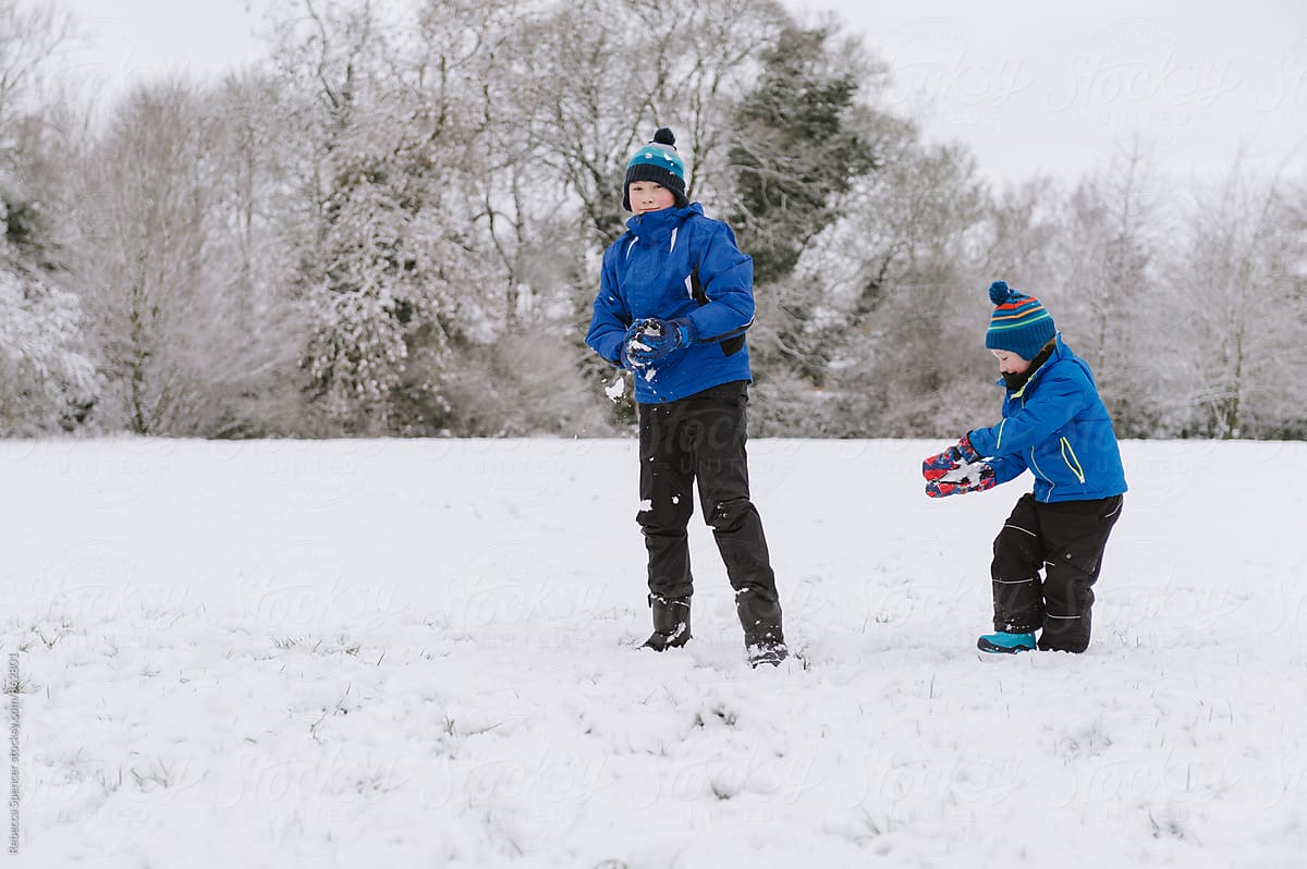 "Older Brother Prepares To Throw Snowball At Viewer" by Stocksy ...