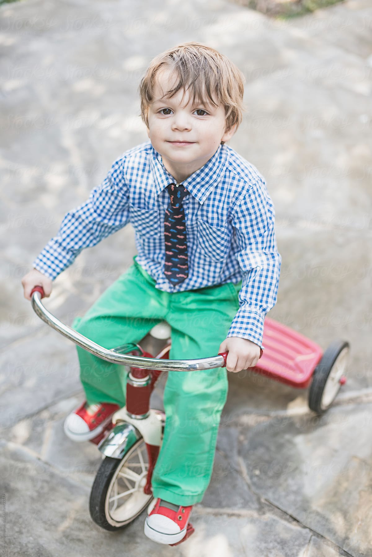 "Dapper Toddler Boy On His Tricycle" by Stocksy Contributor "CWP, LLC ...