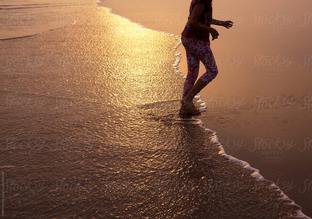 "A Girl Walking On The Beach" by Stocksy Contributor "Dream Lover ...