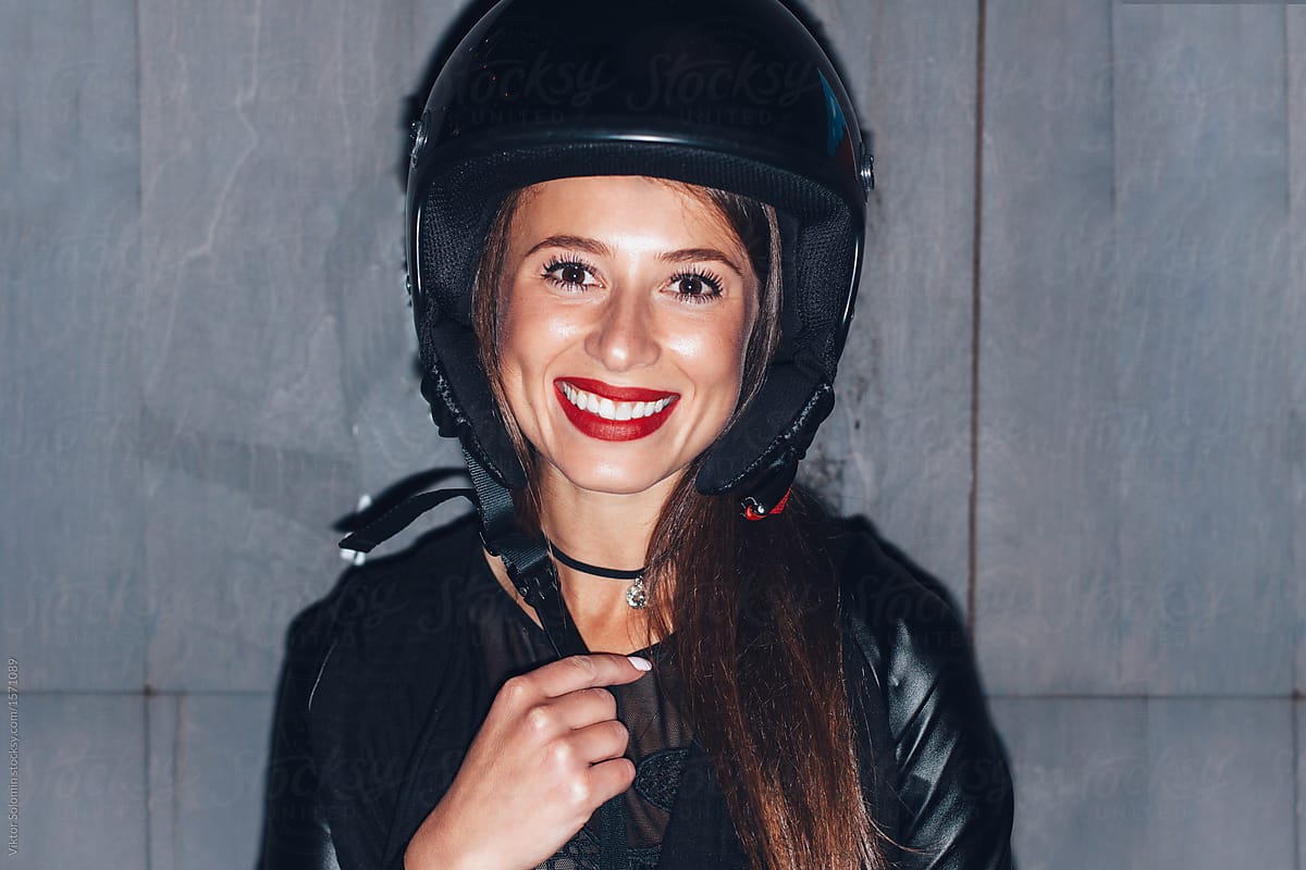 "Smiling Biker Woman Closeup Portrait" by Stocksy Contributor "Viktor ...