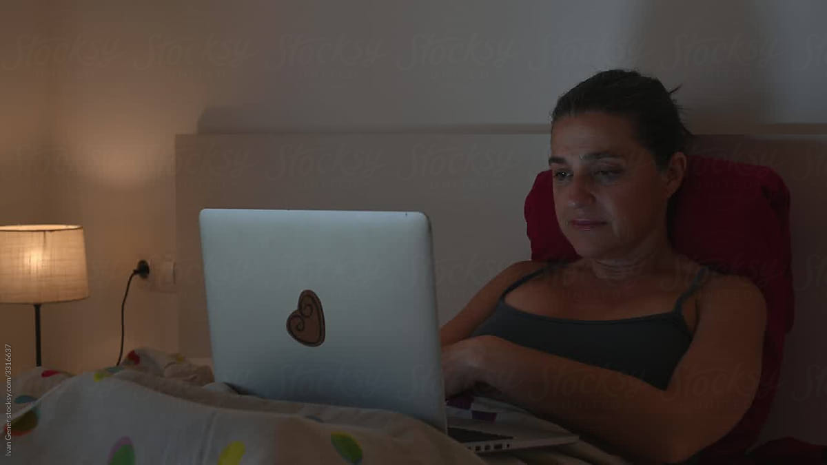 "Sleeping Woman Watching Movie In Bed" by Stocksy Contributor "Ivan ...
