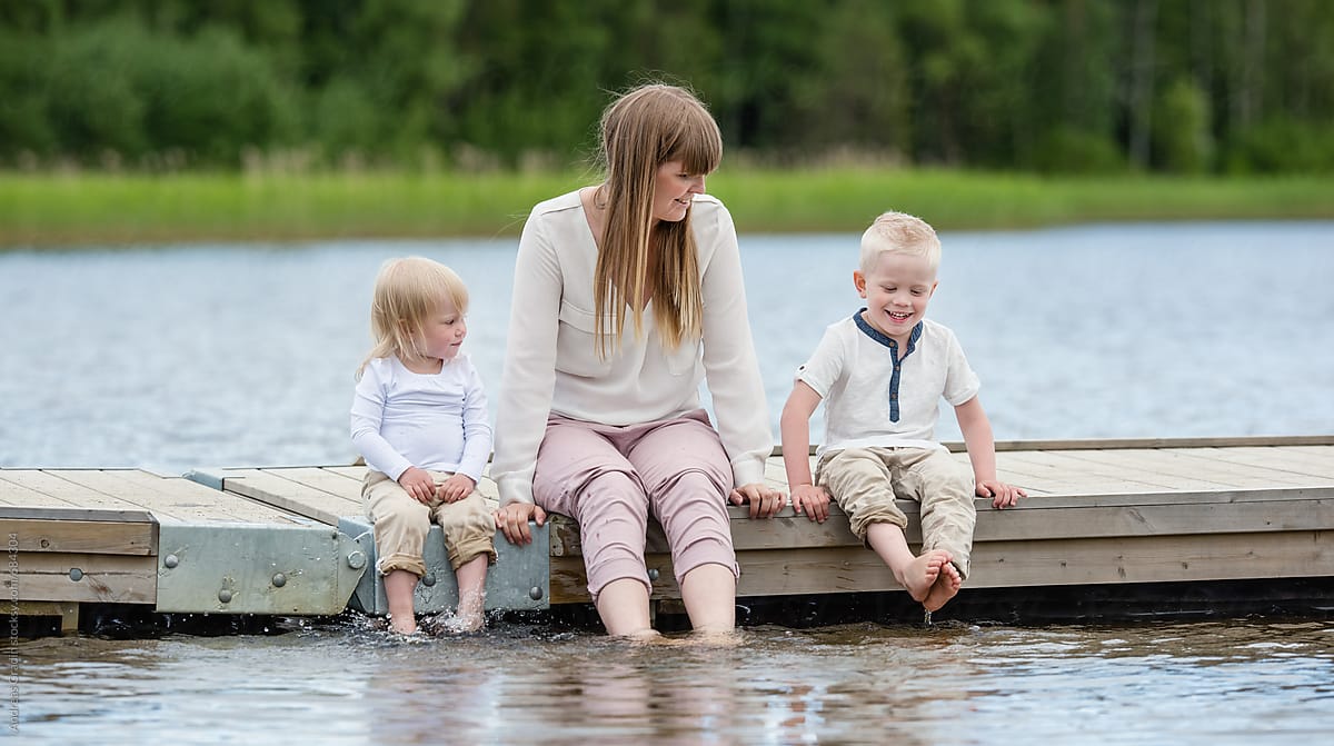 "Mother And Children At The Lake" by Stocksy Contributor "Andreas ...