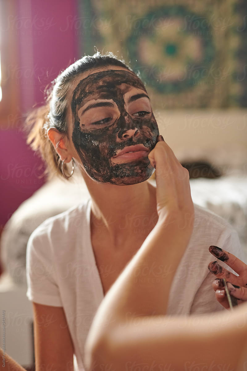 "Loving Girls Applying Face Mask" by Stocksy Contributor "Guille ...