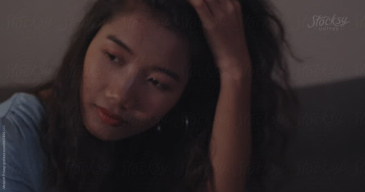 "Woman Feeling Down" by Stocksy Contributor "Adrian P Young" - Stocksy