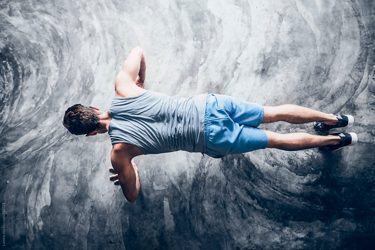 "Man Doing Push Ups On The Floor" by Stocksy Contributor "Lumina" - Stocksy