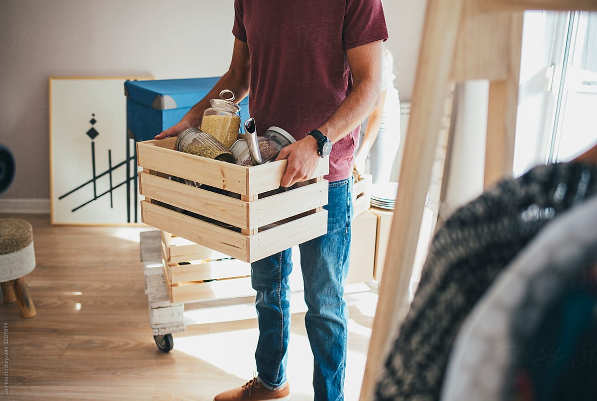 "Man Holding Box For Moving Out" by Stocksy Contributor "Lumina" - Stocksy