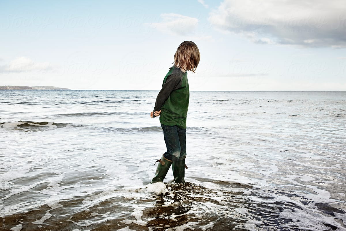 "Standing In The Sea" by Stocksy Contributor "James Ross" - Stocksy