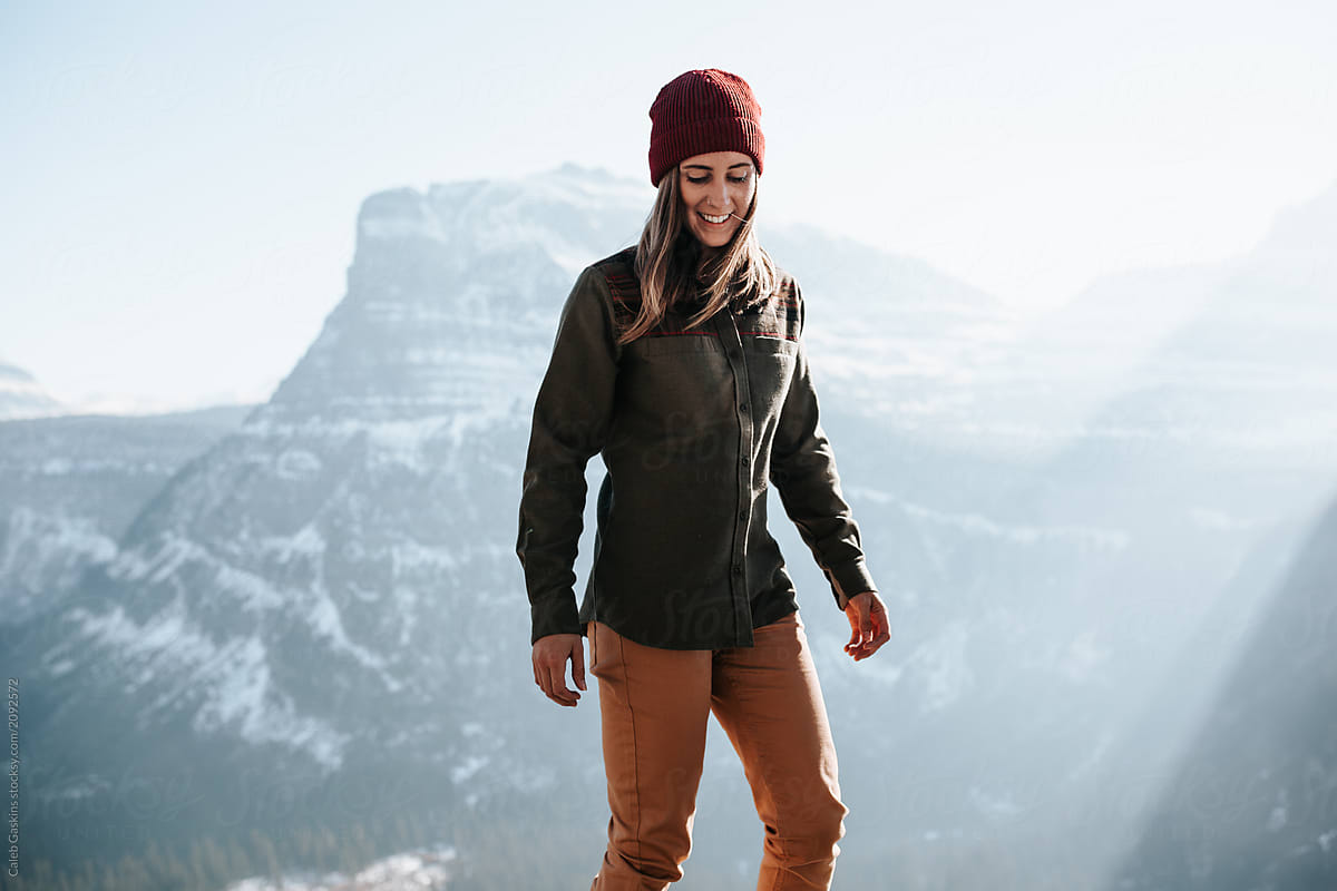 "Woman Walking Along Ledge" by Stocksy Contributor "Caleb Gaskins ...