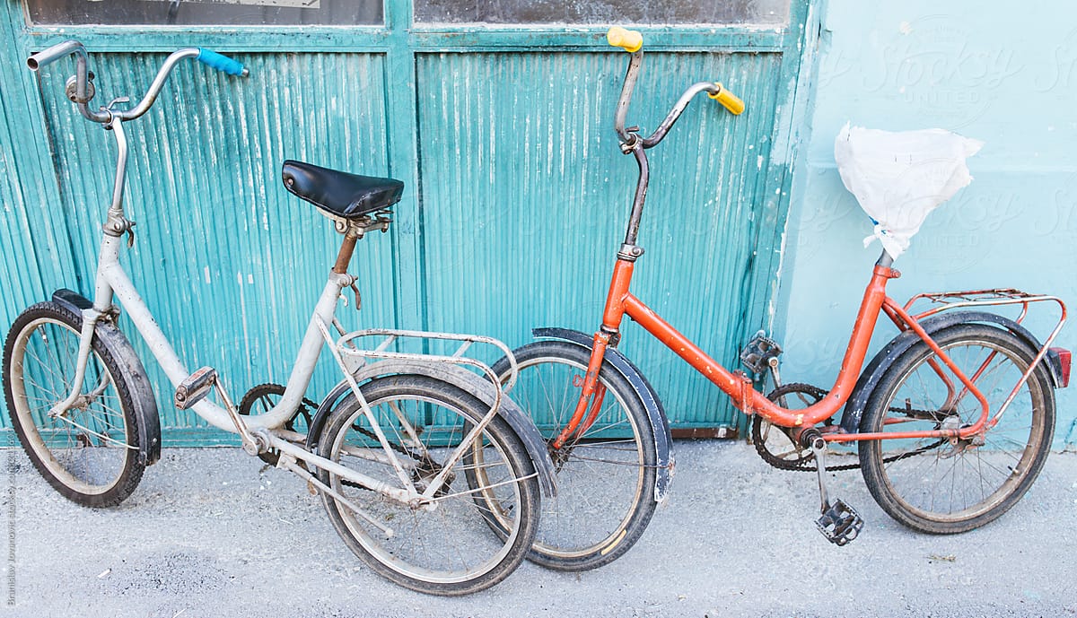"Two Old Bicycles On The Street" by Stocksy Contributor "B Krokodil ...