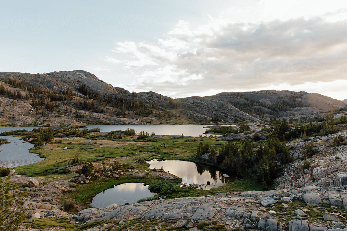 "Lakes And Small Mountains In An Alpine Area Surrounded By Green Grass ...