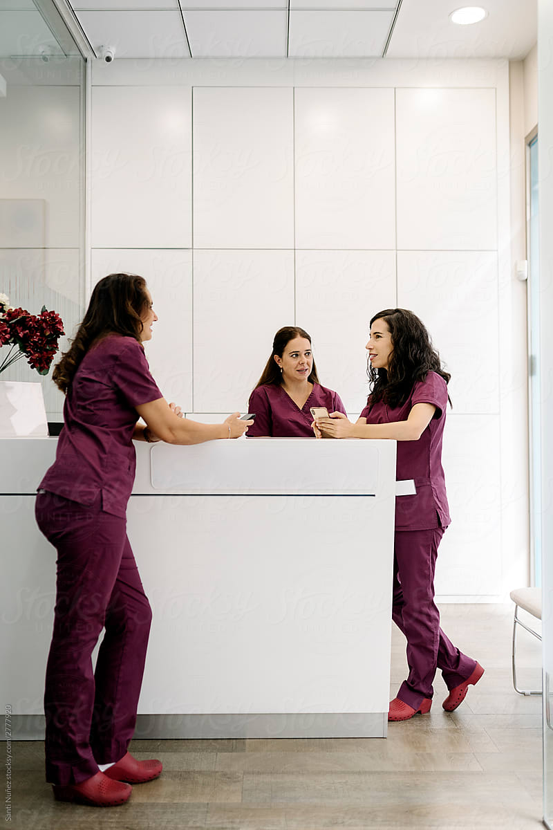 "Conversation Between Doctor And Nurses In Hallway" by Stocksy ...