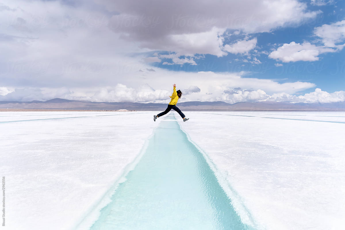 "Woman Jumping On A Salt Flat" by Stocksy Contributor "Bisual Studio ...