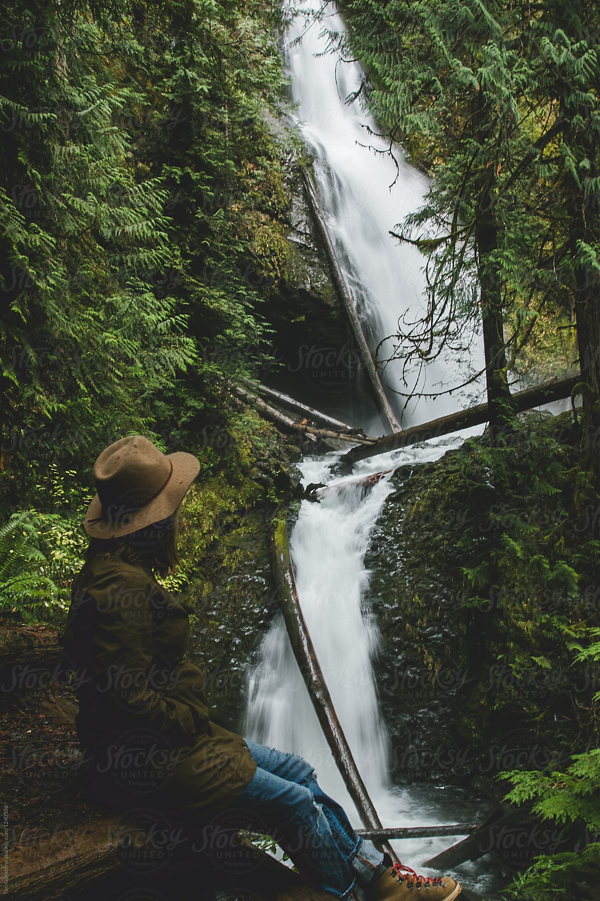 "Woman Looking Out At Waterfall" by Stocksy Contributor "Tari Gunstone ...