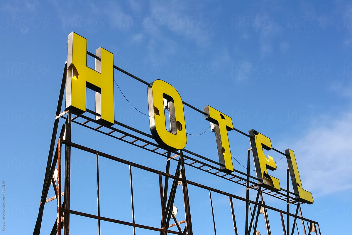 "Yellow Hotel Sign Letters Broken And Blue Sky." by Stocksy Contributor ...