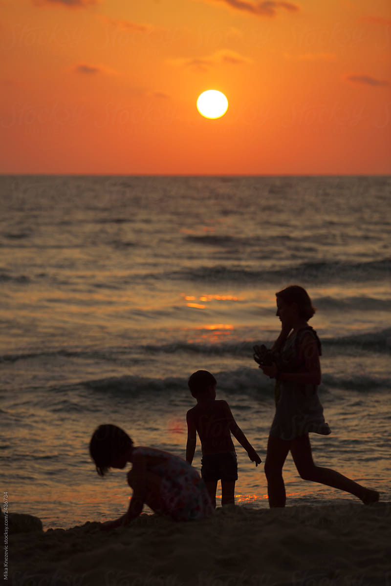 "Kids Playing On The Beach At Sunset" by Stocksy Contributor "Mika ...