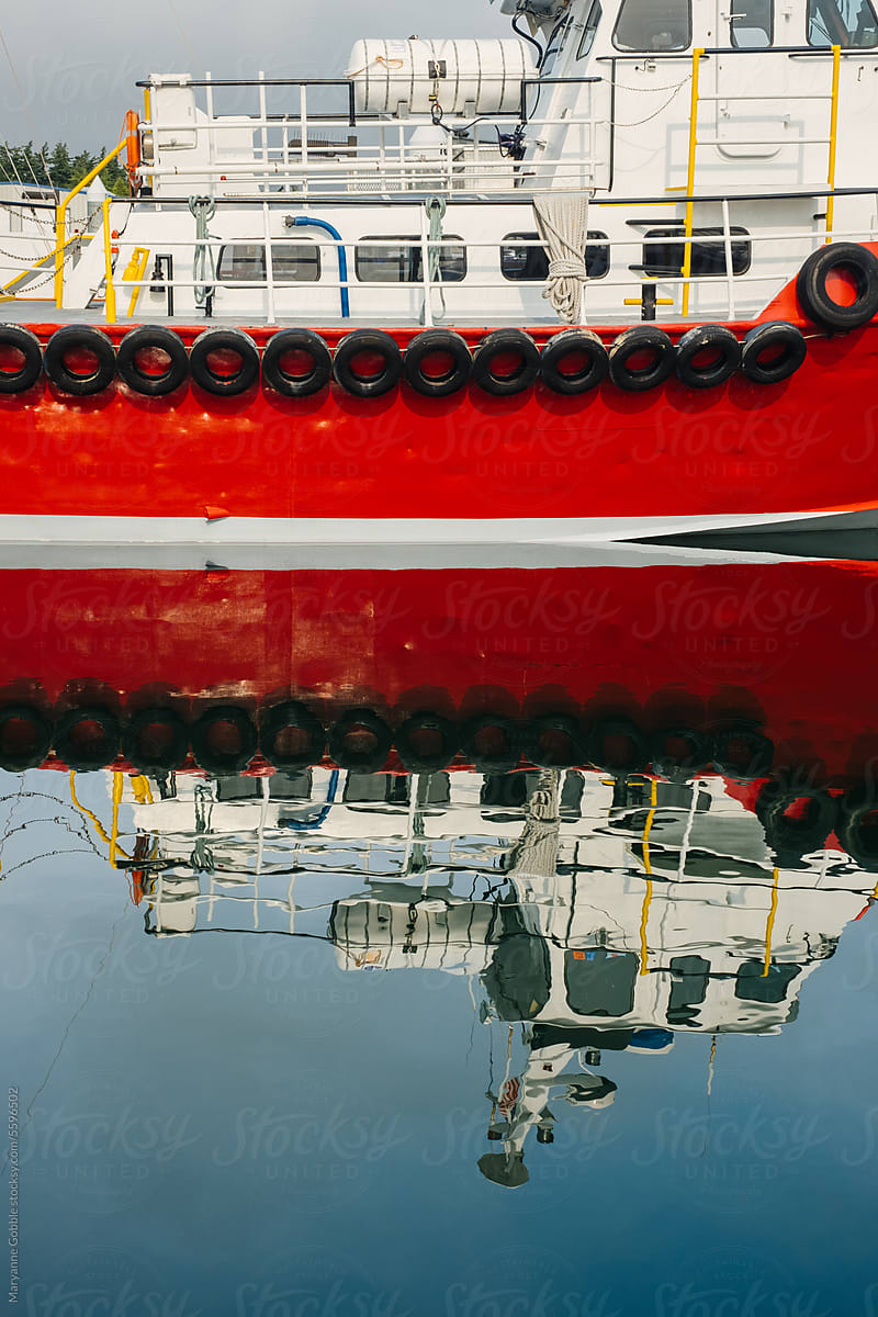 "Boat Reflection" by Stocksy Contributor "Maryanne Gobble" - Stocksy