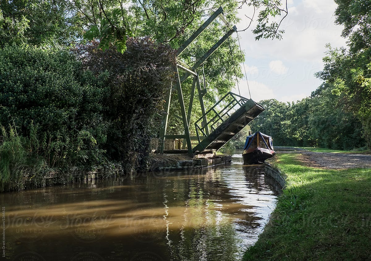 "Canal Boat Passing Under A Raised Bridge. Shropshire, UK." by Stocksy ...