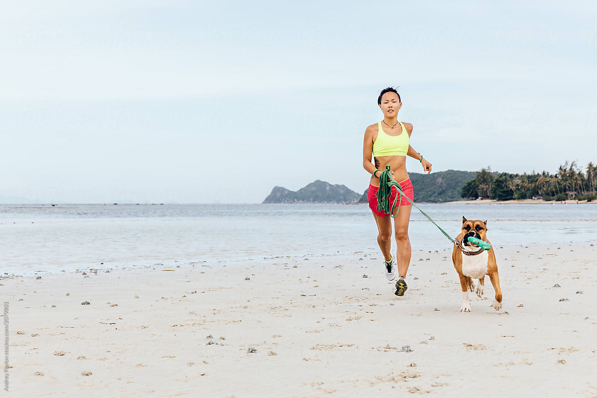 "Morning Jogging With The Dog" by Stocksy Contributor "Andrey Pavlov ...