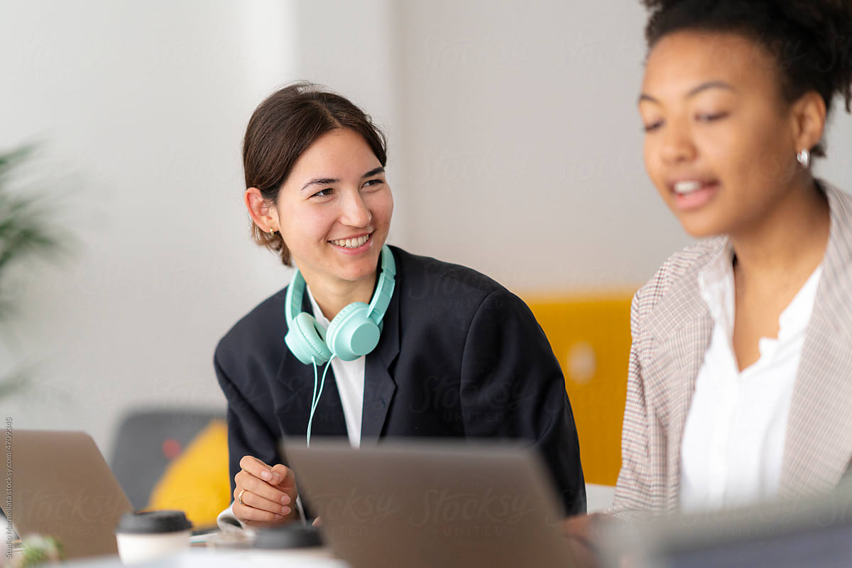 "Happy Diverse Women Communicating In Office" by Stocksy Contributor ...