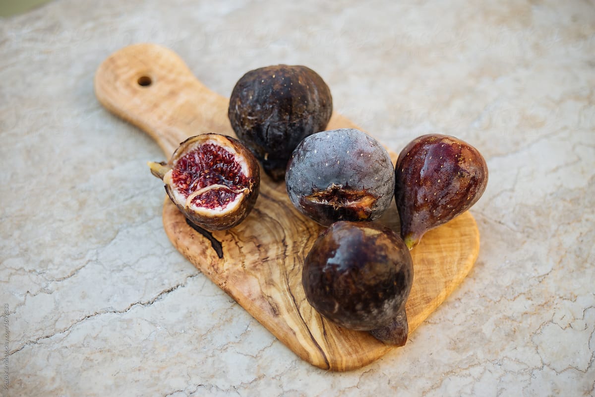 "Ripe Figs On Olive Tree Board" by Stocksy Contributor "Pietro Karras ...