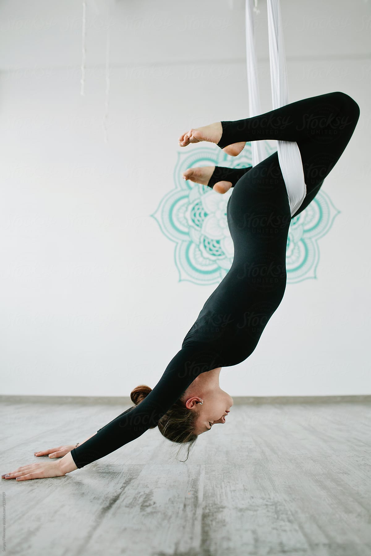 "Young Woman Performing Aerial Yoga Exercise" by Stocksy Contributor ...