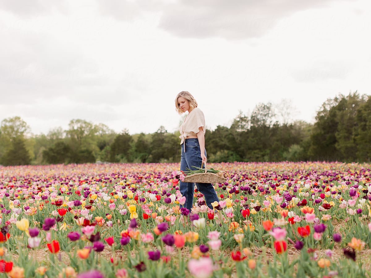"Walking In A Field Of Flowers" by Stocksy Contributor "Marta Locklear ...