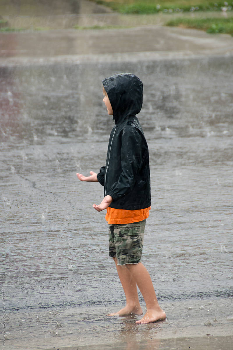 "Little Boy In The Rain" by Stocksy Contributor "Rebecca Rockwood ...