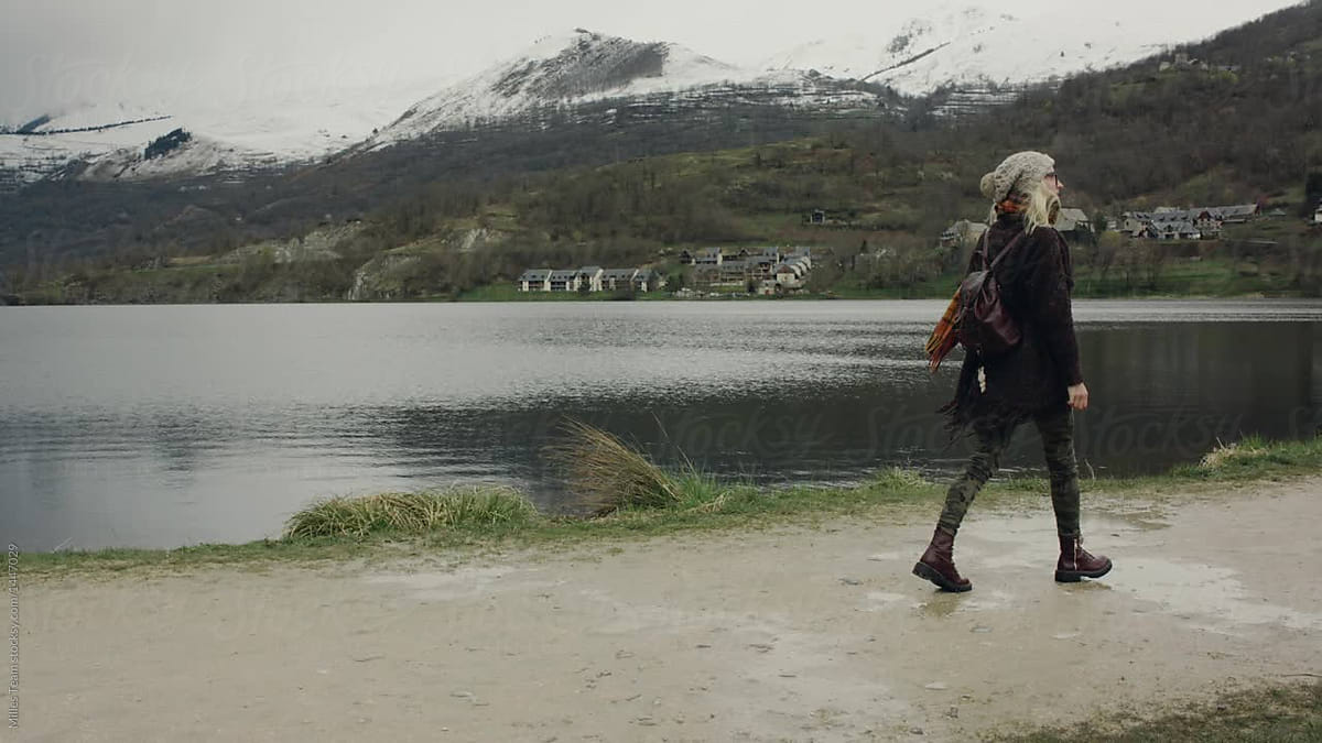 "Woman Walking Near Lake" by Stocksy Contributor "Milles Team" - Stocksy