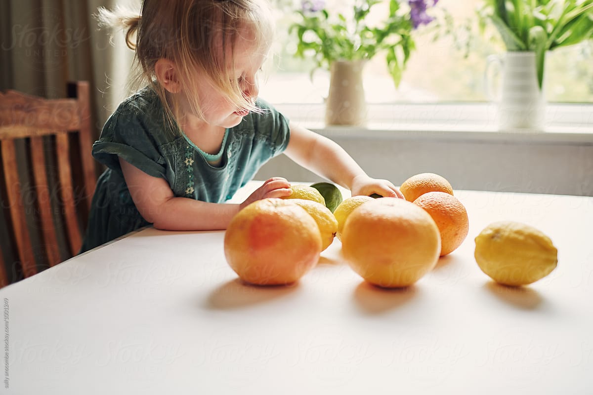"Child Choosing Some Fruit" by Stocksy Contributor "Sally Anscombe ...