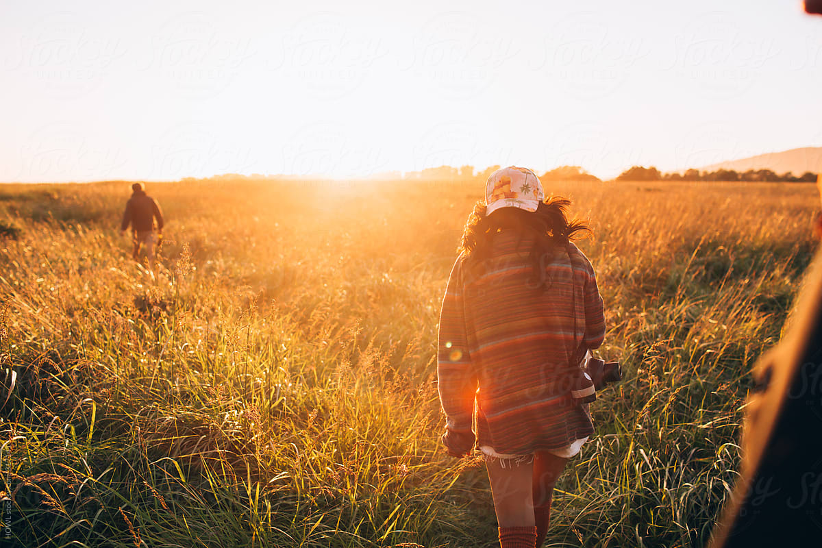 "Friends Travel Along A Path Walking Into The Sun." by Stocksy ...
