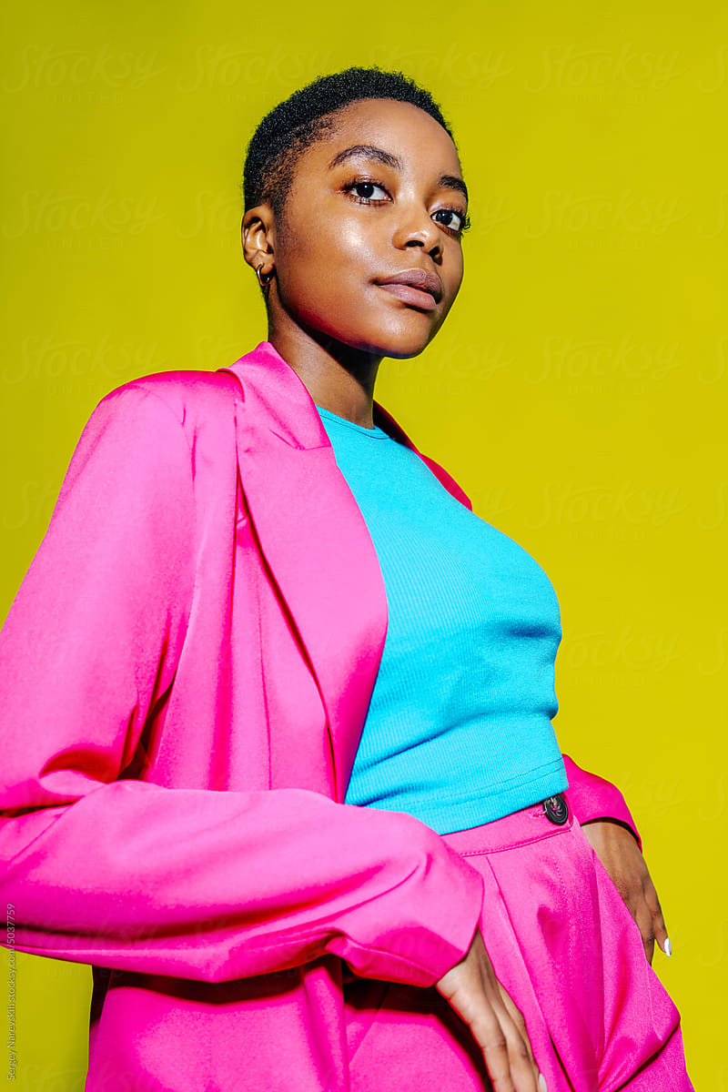 "African Female In Pink Suit" by Stocksy Contributor "Sergey Narevskih ...