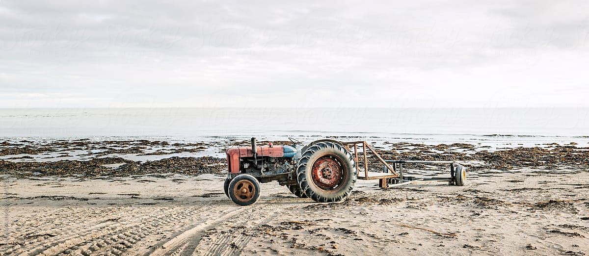 "Tractor On The Beach" by Stocksy Contributor "James Ross" - Stocksy