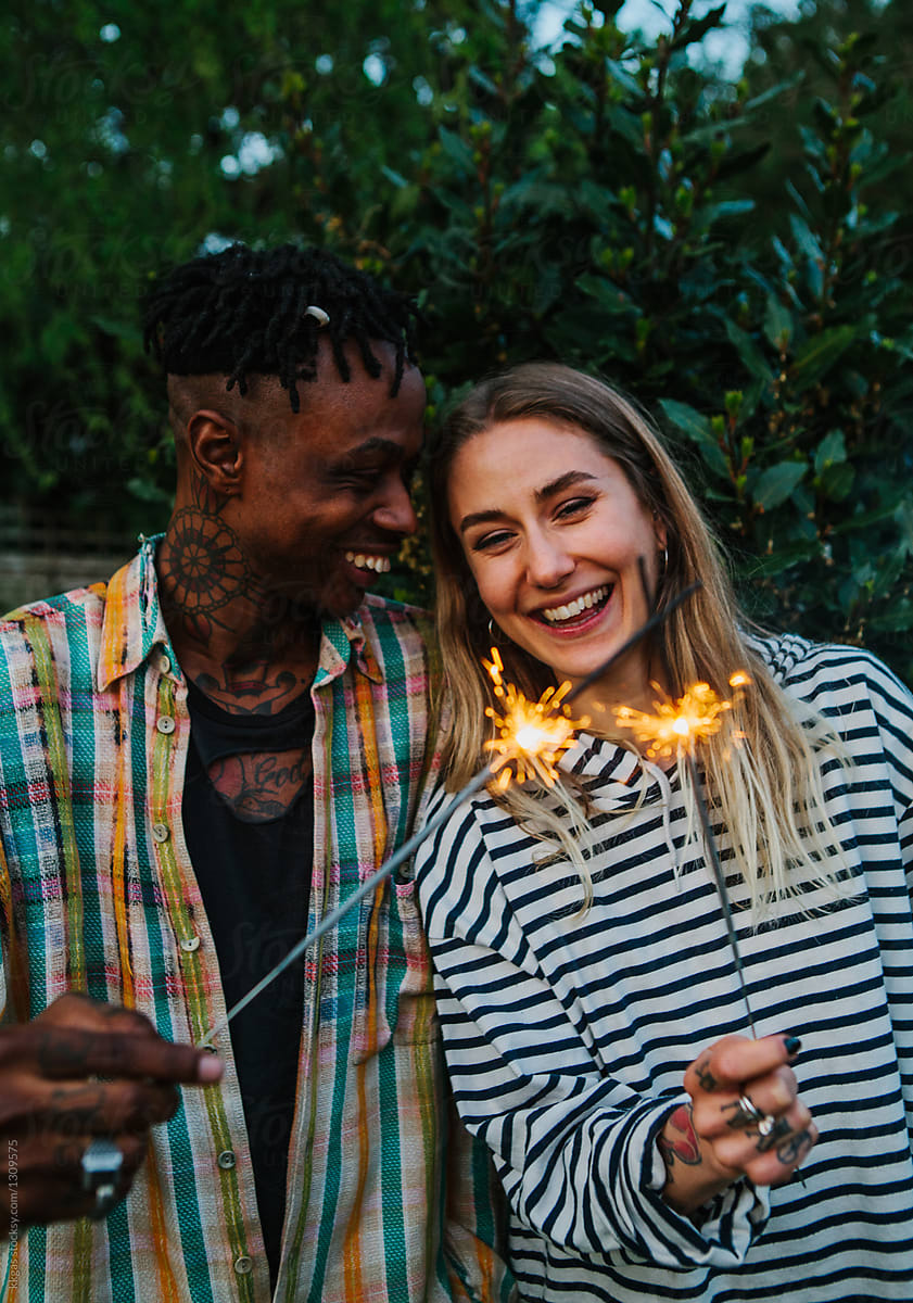 "Cool Friends Playing With A Sparkler On A Summer Evening" by Stocksy ...
