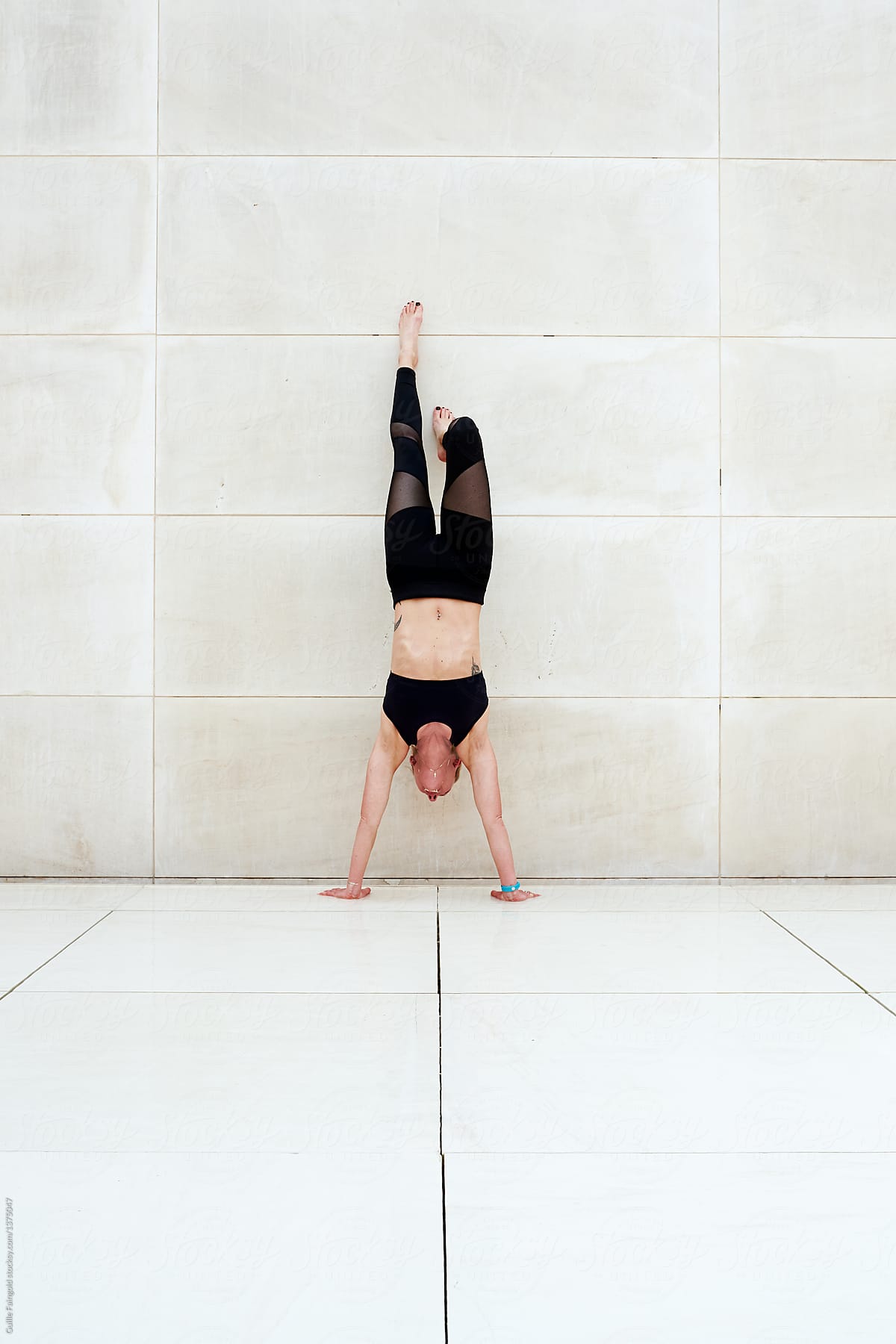 "Fit Woman Standing On Hands" by Stocksy Contributor "Guille Faingold ...