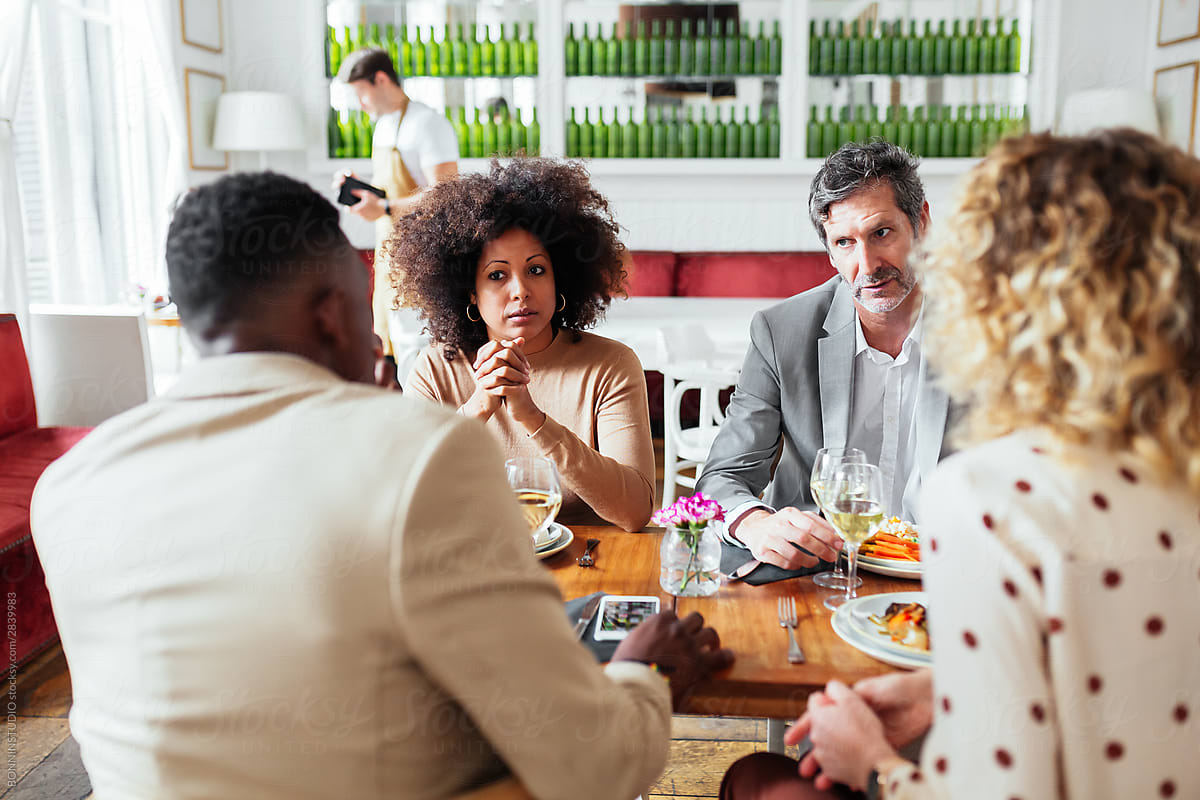 "Diverse People Talking During Dinner In Restaurant" by Stocksy ...