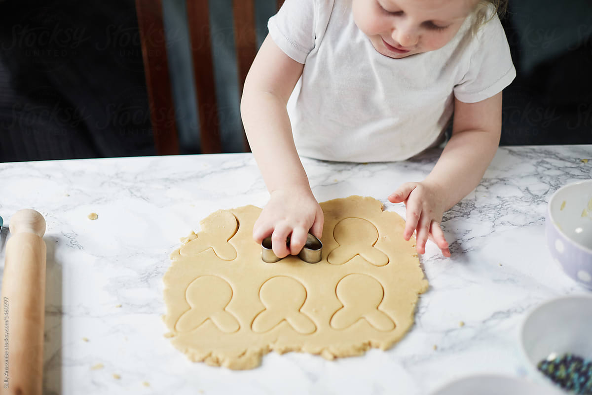 "Child Baking Biscuits" by Stocksy Contributor "Sally Anscombe" - Stocksy
