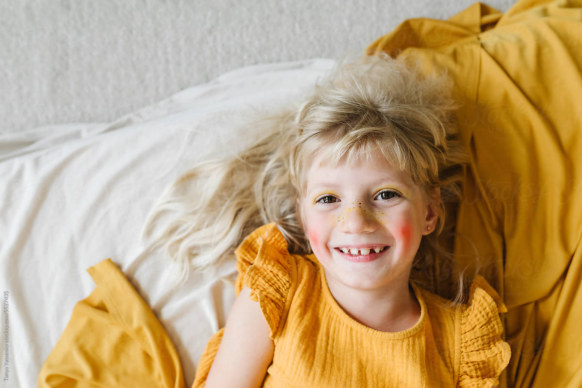 "A Happy Girl In Yellow Dress" by Stocksy Contributor "Yatanni" - Stocksy