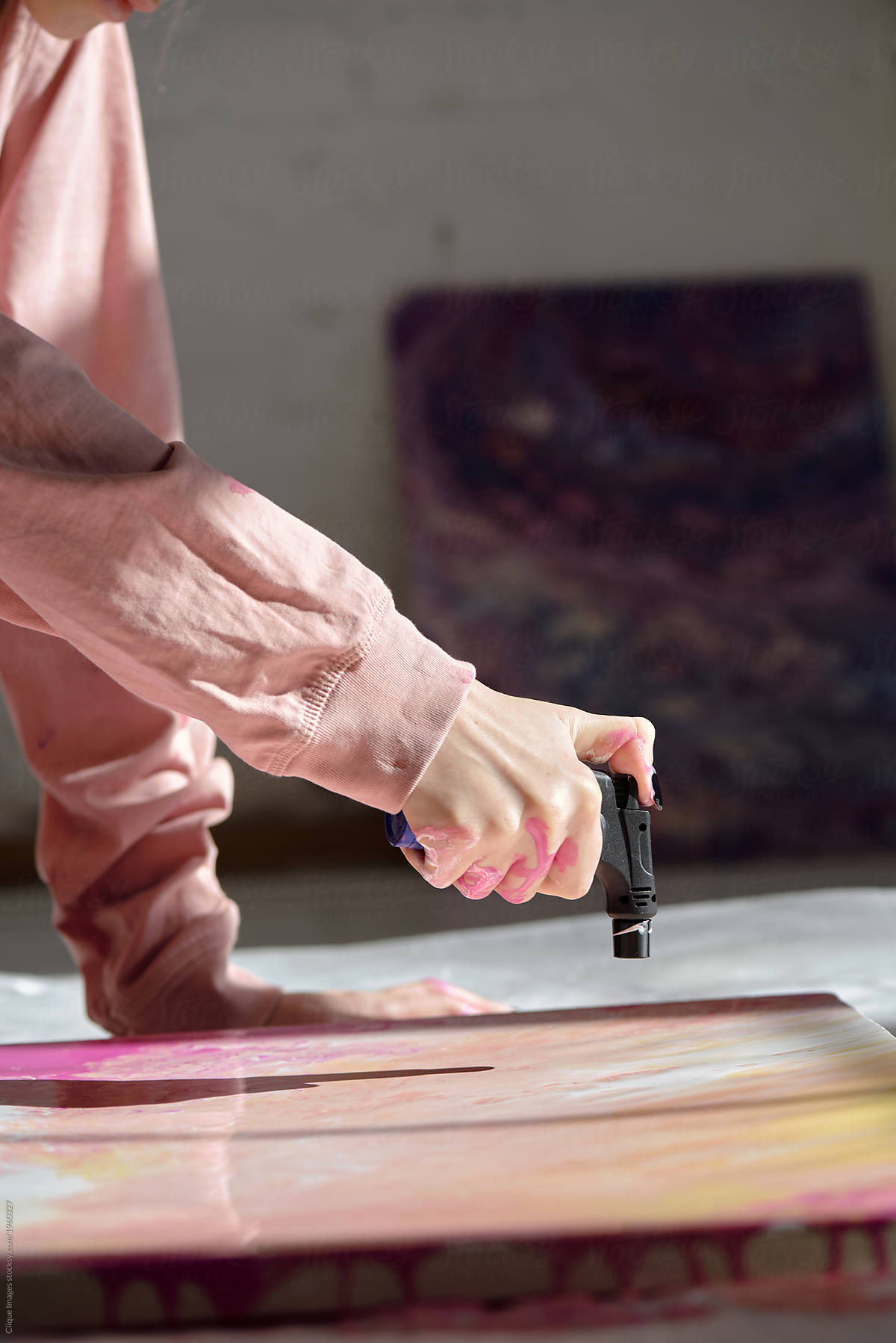 "Artist Using Paint Sprayer" by Stocksy Contributor "Clique Images ...