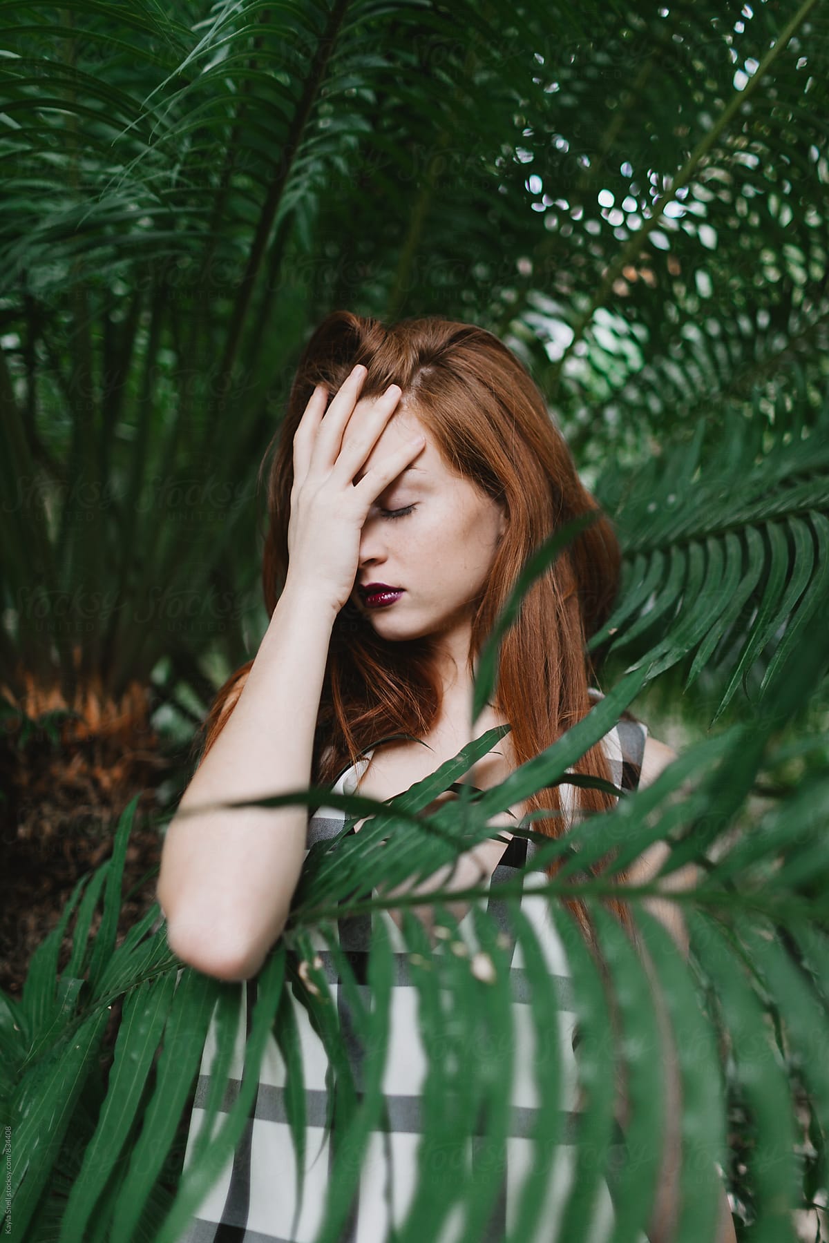 "Woman Hiding Herself Behind A Plant" by Stocksy Contributor "Kayla ...