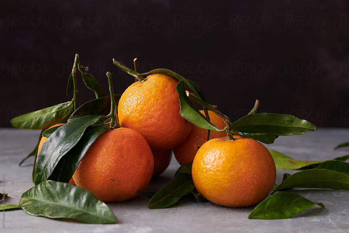 "Clementines On Table" by Stocksy Contributor "Jeff Wasserman" - Stocksy