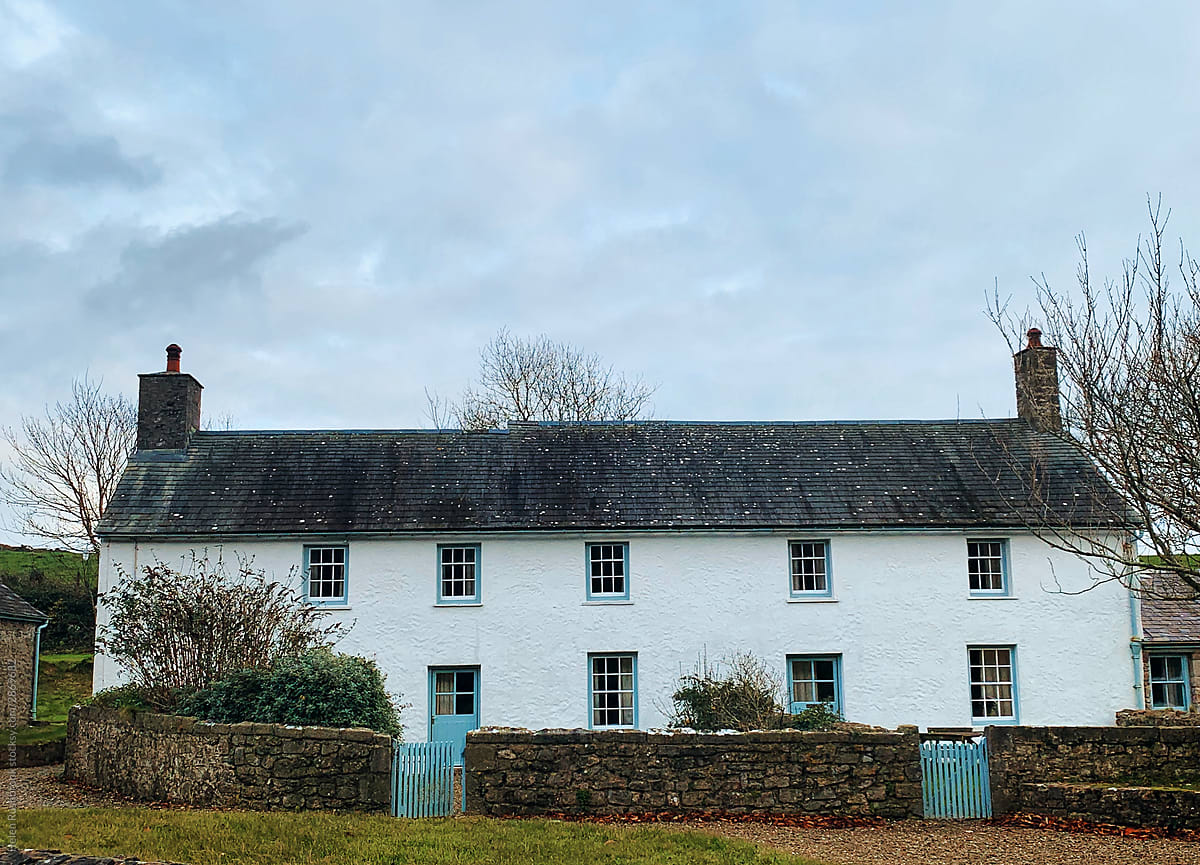 "Cottages, Bare Trees, Winter Sky." by Stocksy Contributor "Helen ...