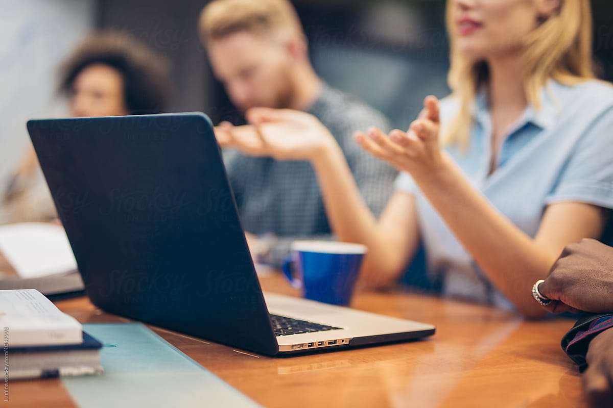 "Laptop In A Meeting Room" by Stocksy Contributor "Lumina" - Stocksy